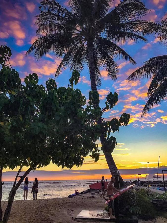 Aloha Friday Photo: Evening surfers at Kahanamoku Beach - Go Visit Hawaii